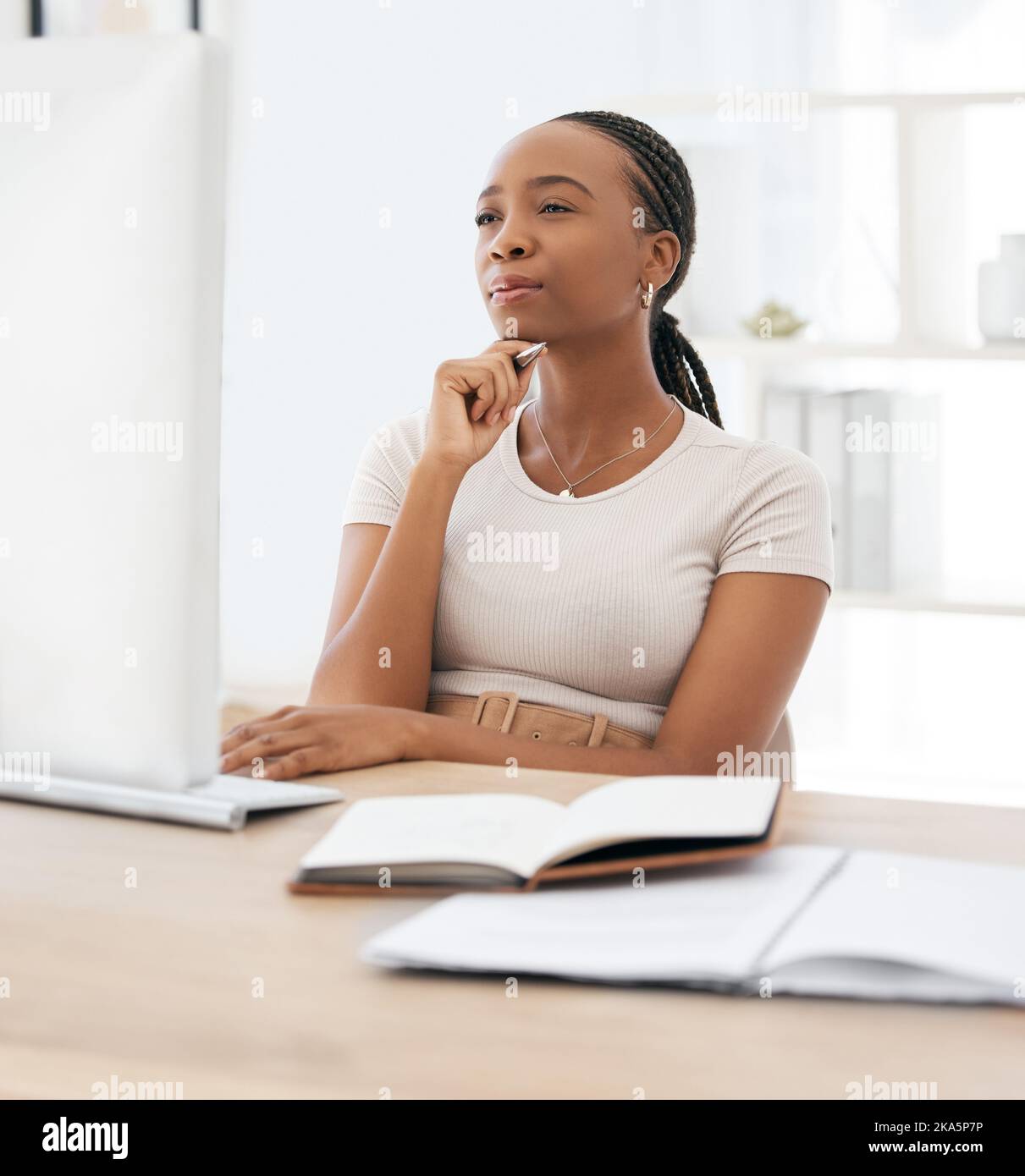 Thinking, research and notebook with black woman at computer for ...