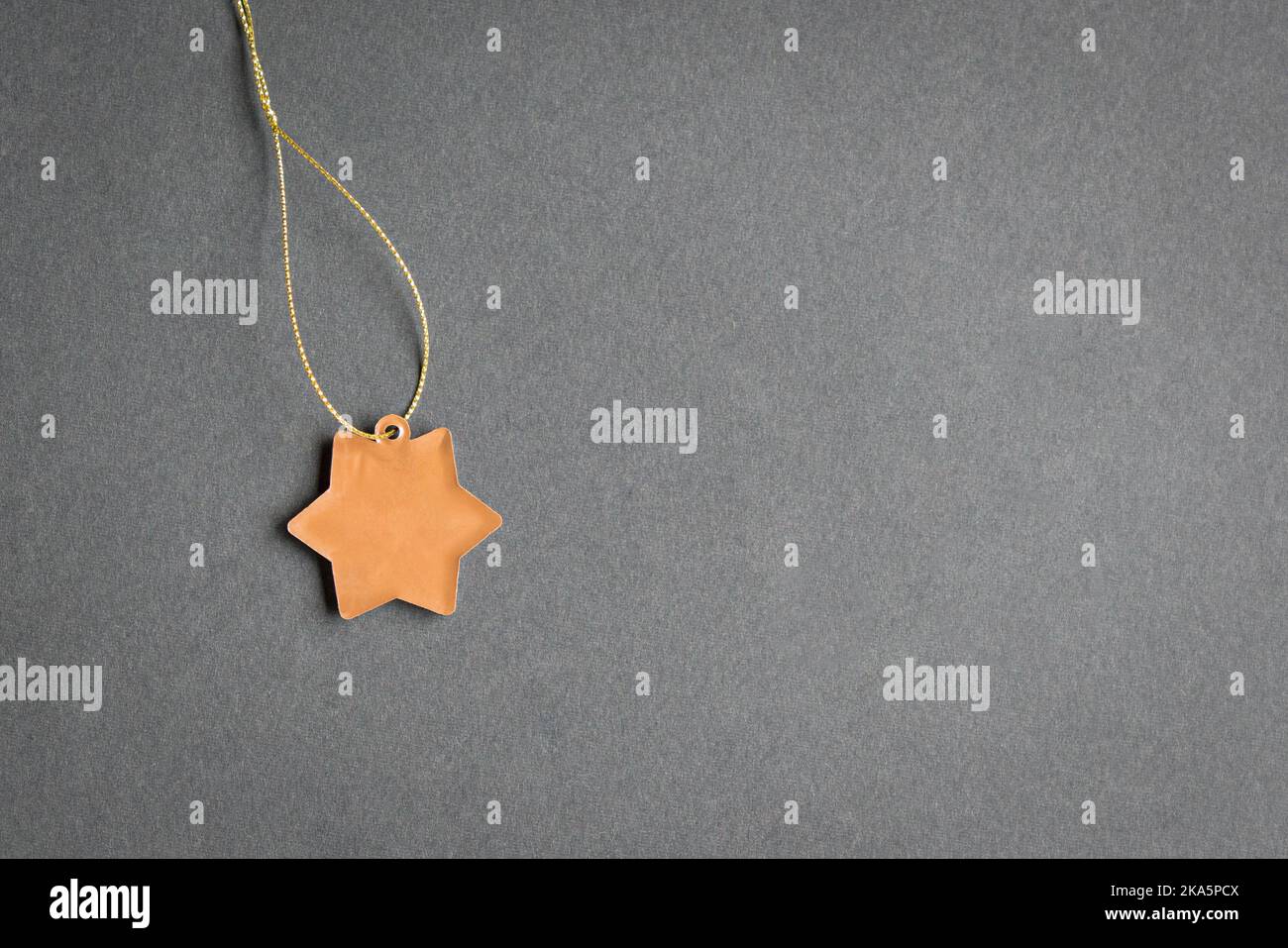 Star shape tag on grey background. Copy space. Template or mockup for ...