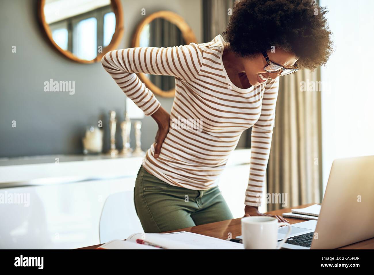 This is what you get if you sit too long. a uncomfortable looking young ...