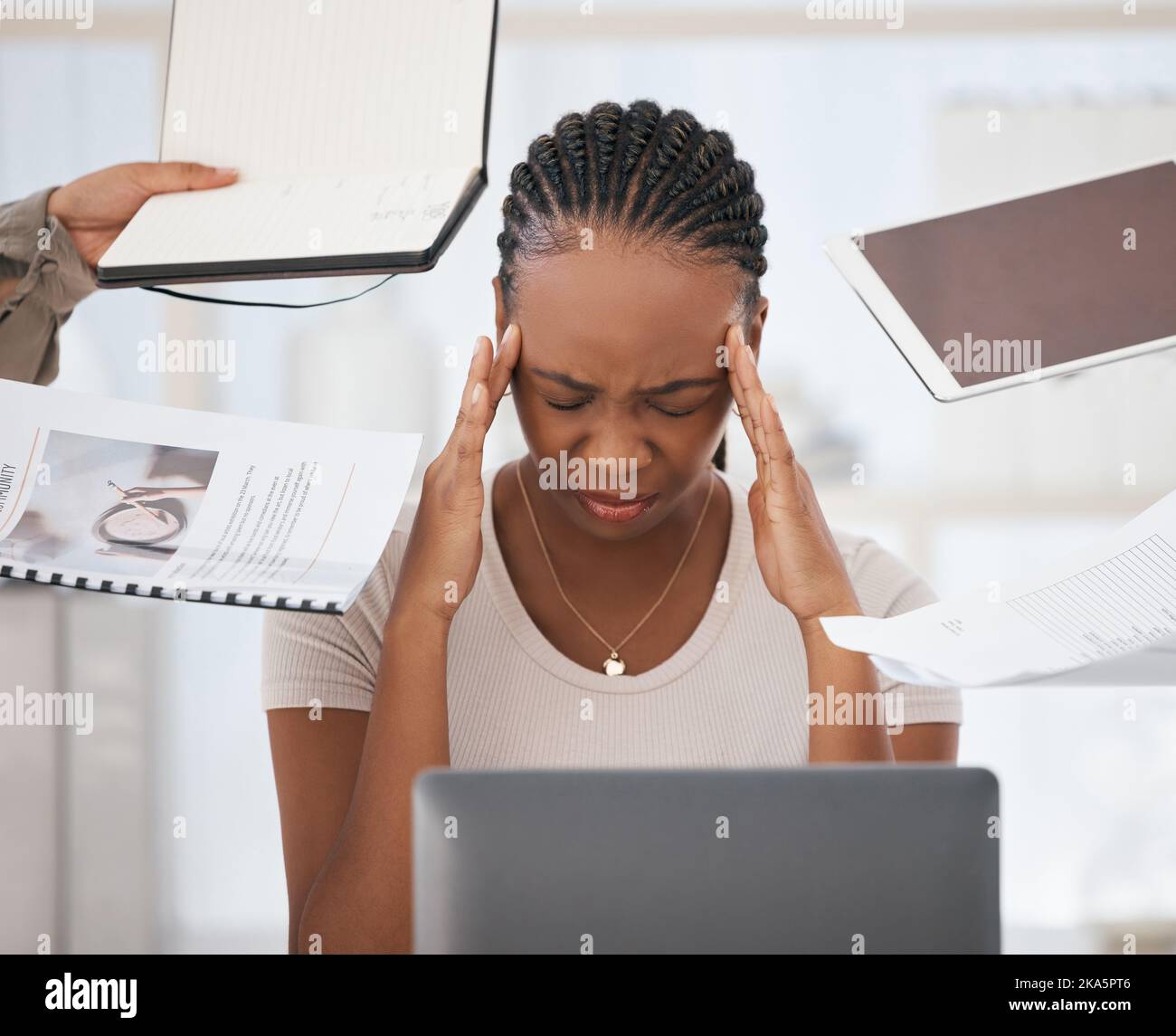 Headache, stress and burnout of black woman in office on laptop ...