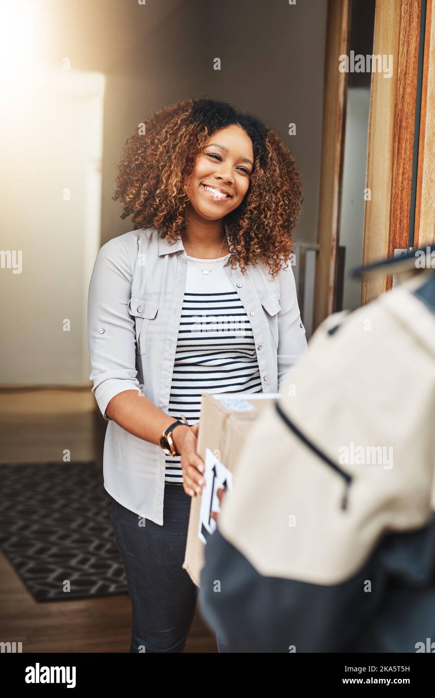 Right on time, just as promised. a young woman receiving a delivery ...