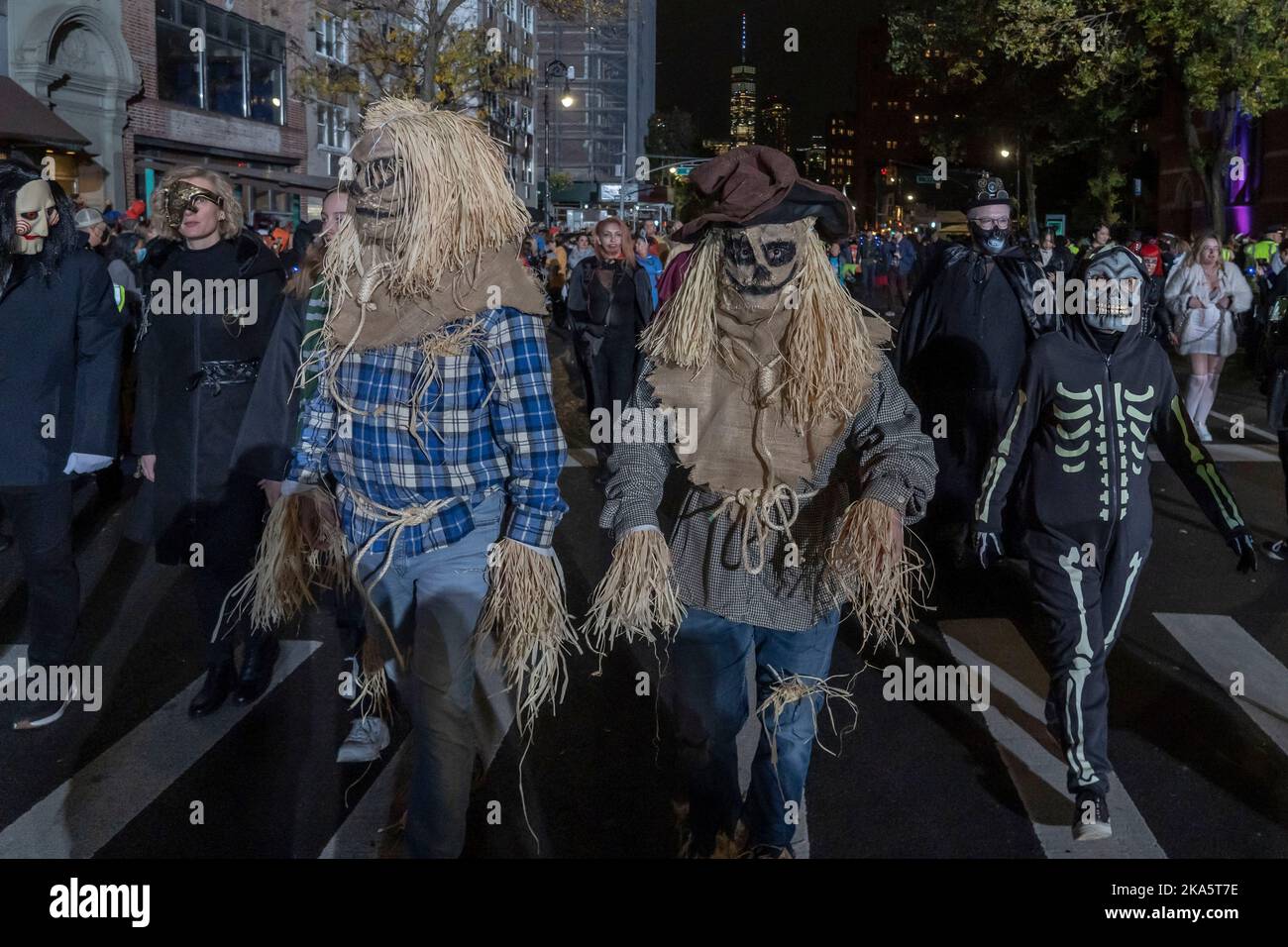 NEW YORK, NY - OCTOBER 31: Revelers dressed in costume participate in ...