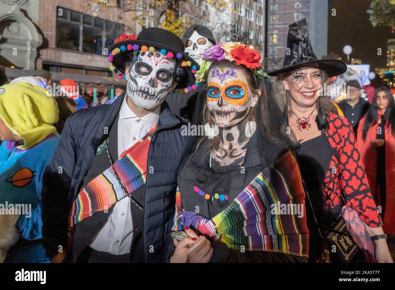 NEW YORK, NY - OCTOBER 31: Revelers dressed in costume participate in ...
