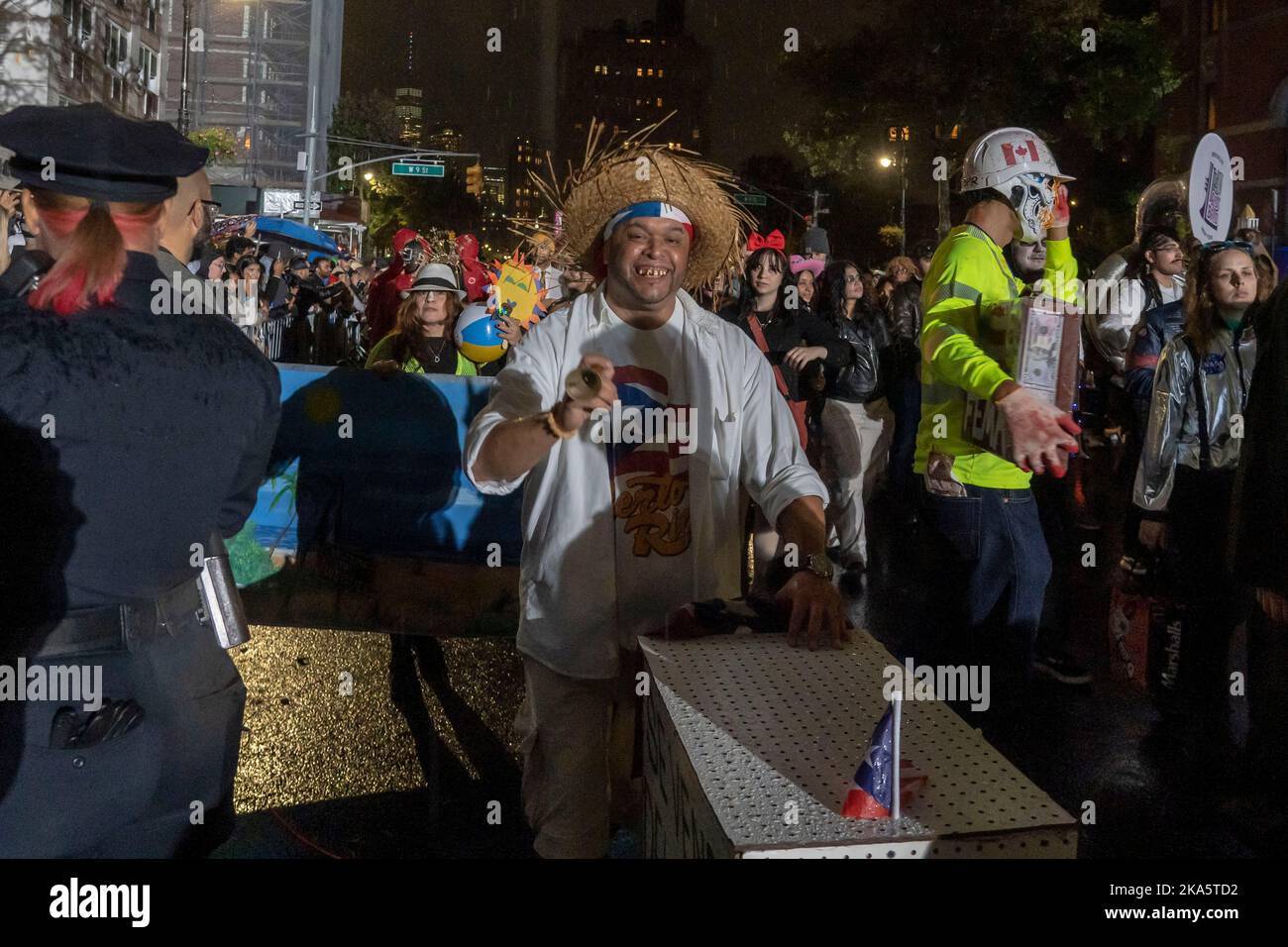 NEW YORK, NY - OCTOBER 31: Revelers dressed in costume participate in ...