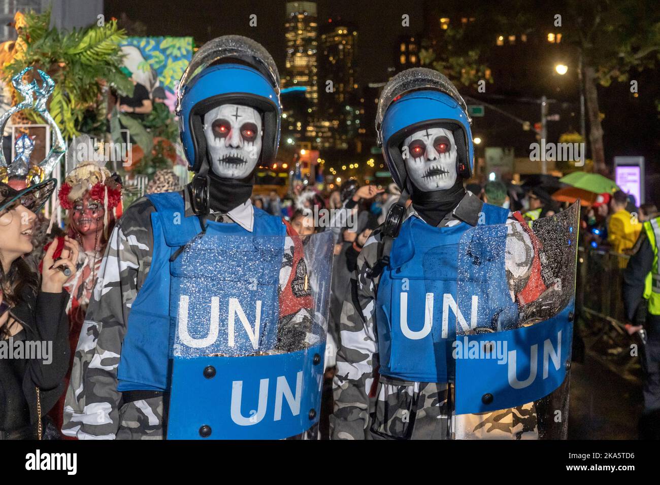 NEW YORK, NY - OCTOBER 31: Revelers dressed in costume participate in ...