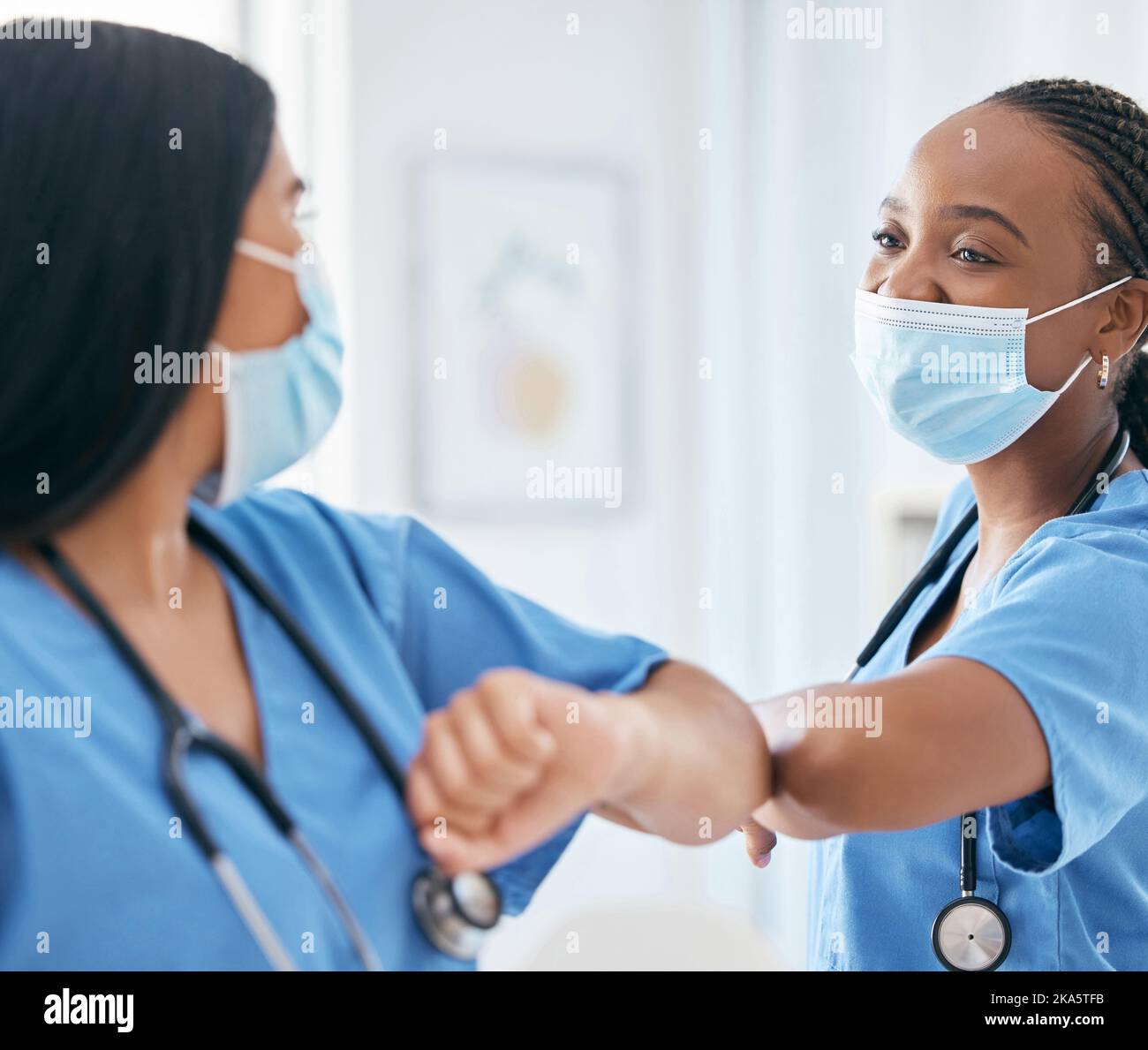 Elbow greeting, covid nurses and meeting in hospital, clinic and ...