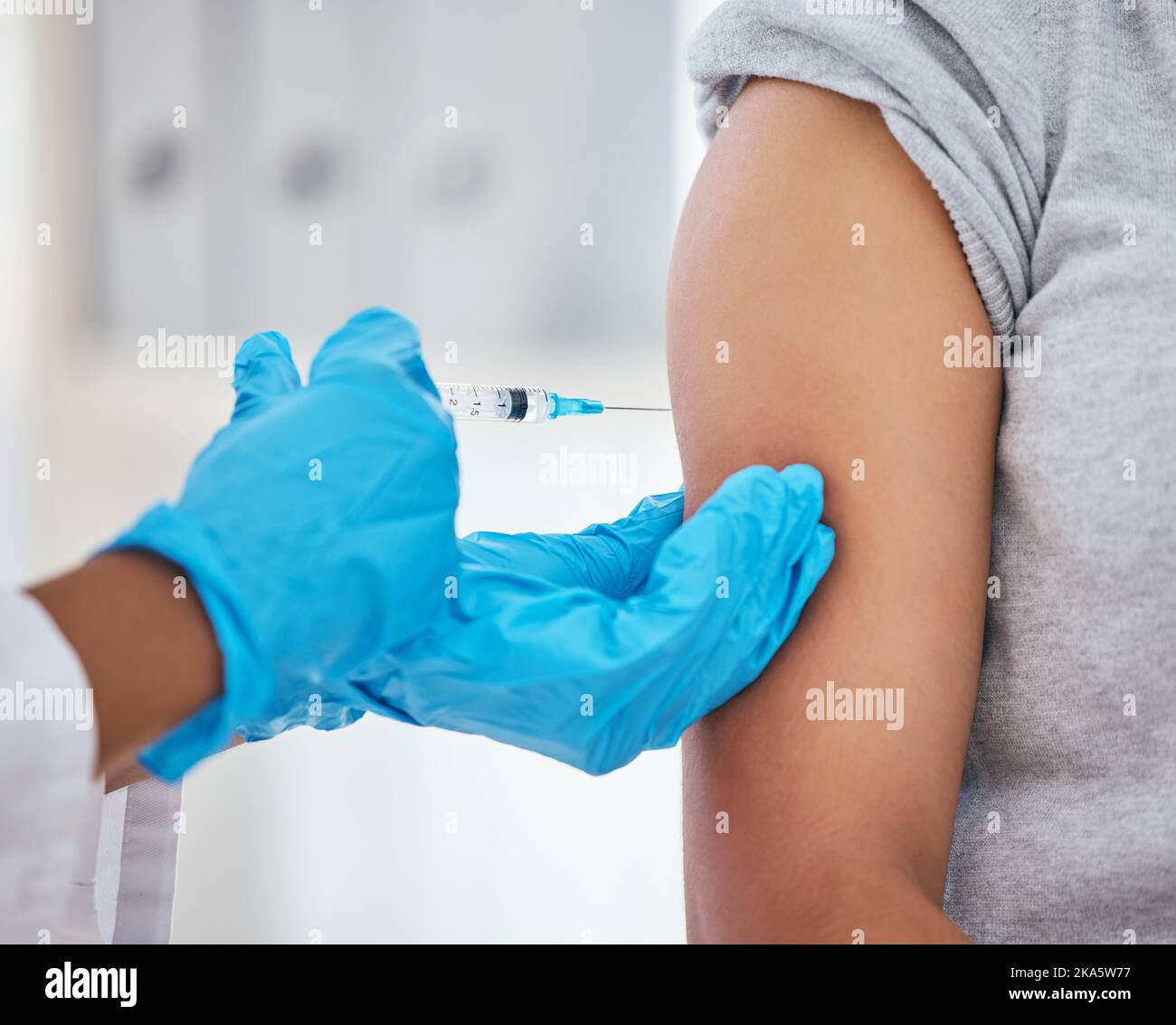 Covid vaccine, needle and patient getting an injection from a doctor ...