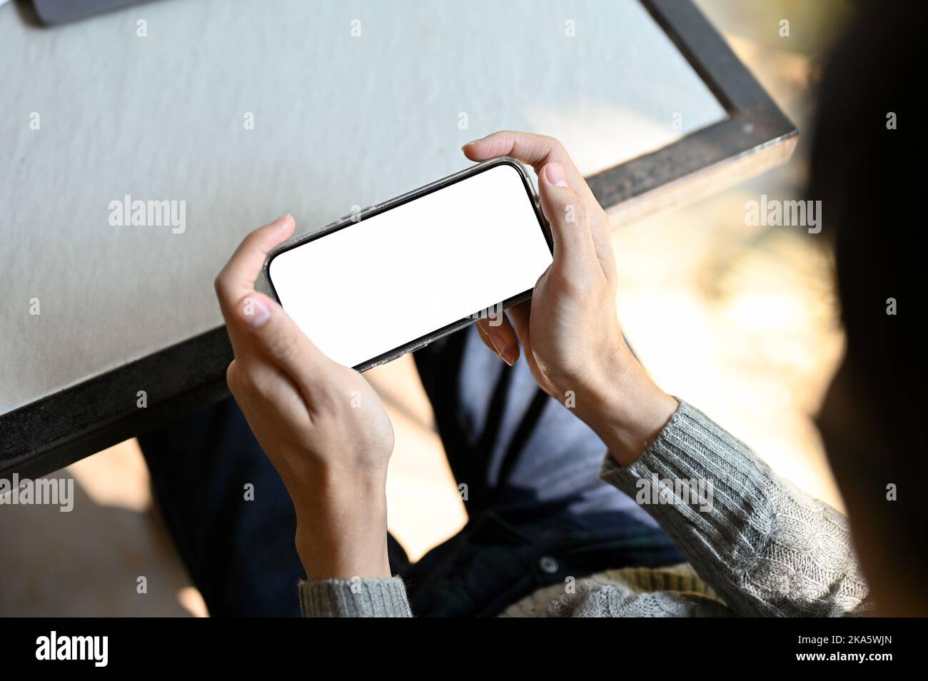 Handsome Asian man watching some video on his smartphone. mobile phone ...