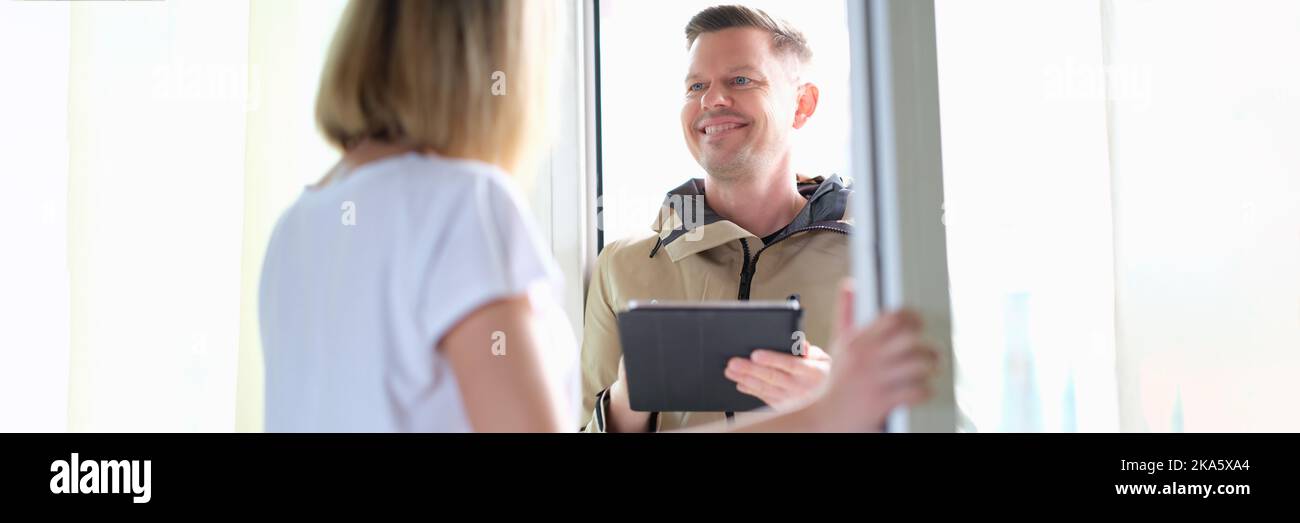 Smiling man conducting social survey in apartment Stock Photo - Alamy