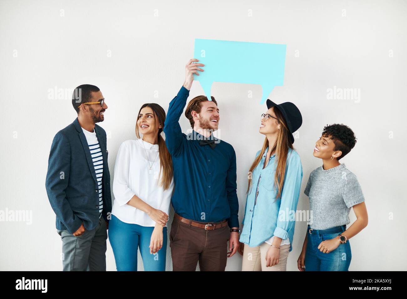 Great minds think alike. a diverse group of creative employees holding ...