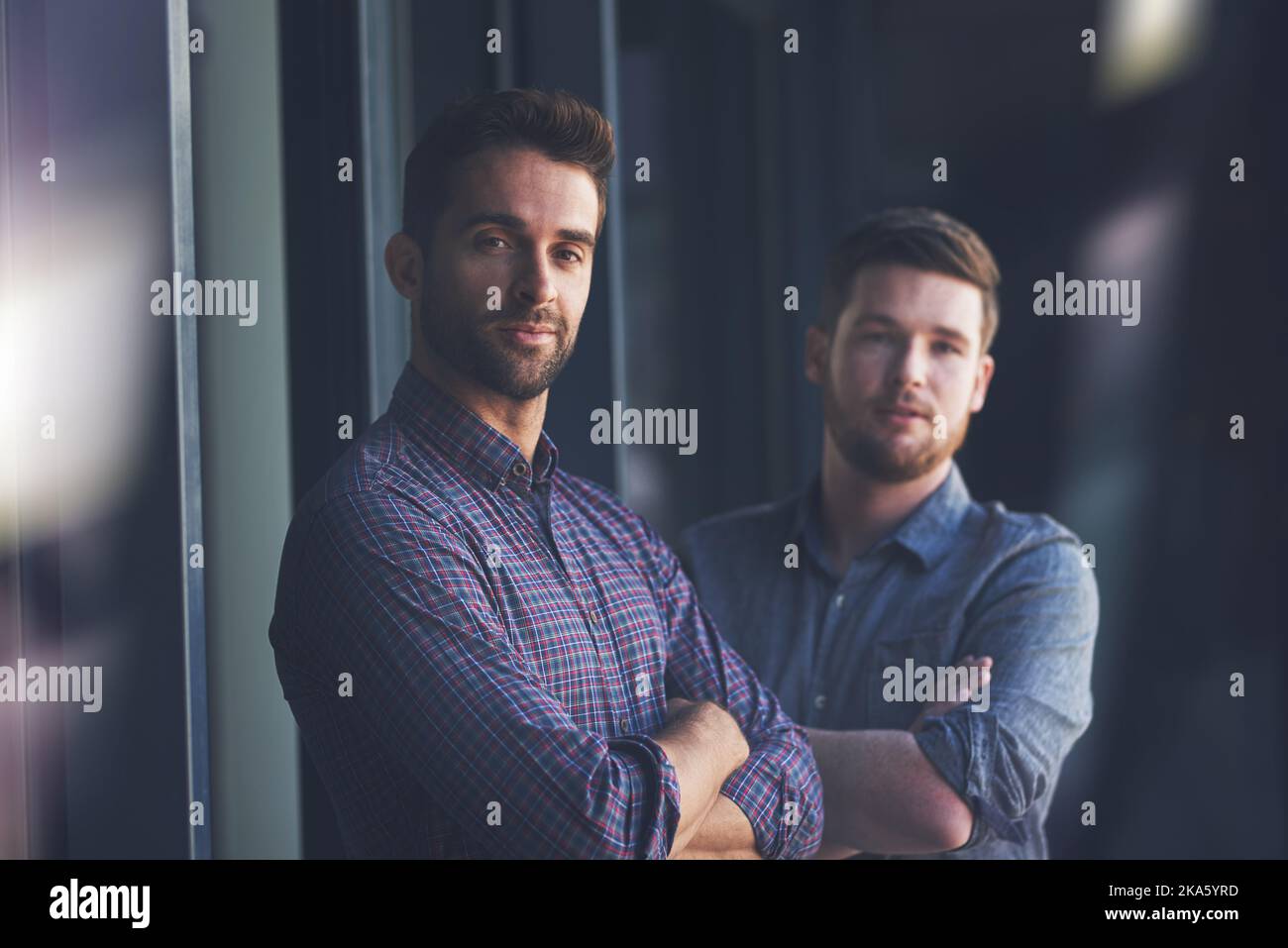 Excellence is what we strive for. Portrait of two confident young ...