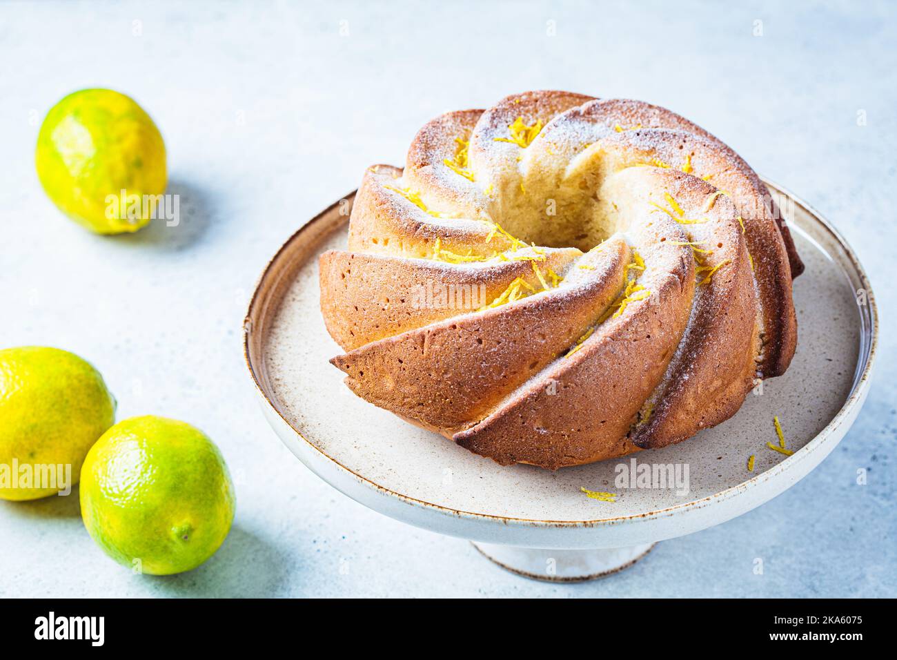 Traditional lemon cake on a cake stand, gray background Stock Photo - Alamy