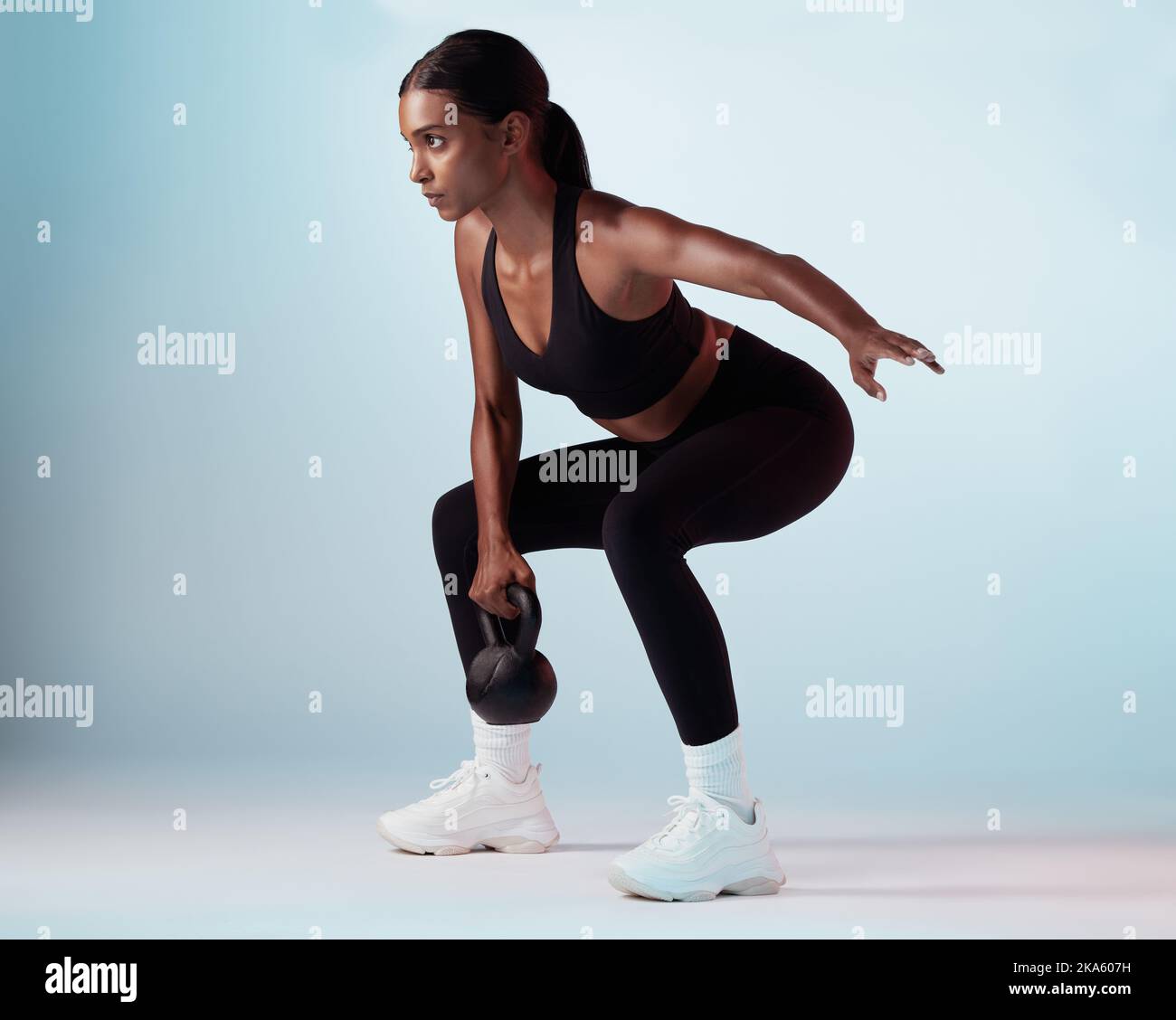 Black woman, kettlebell and exercise for wellness, focus or motivation ...