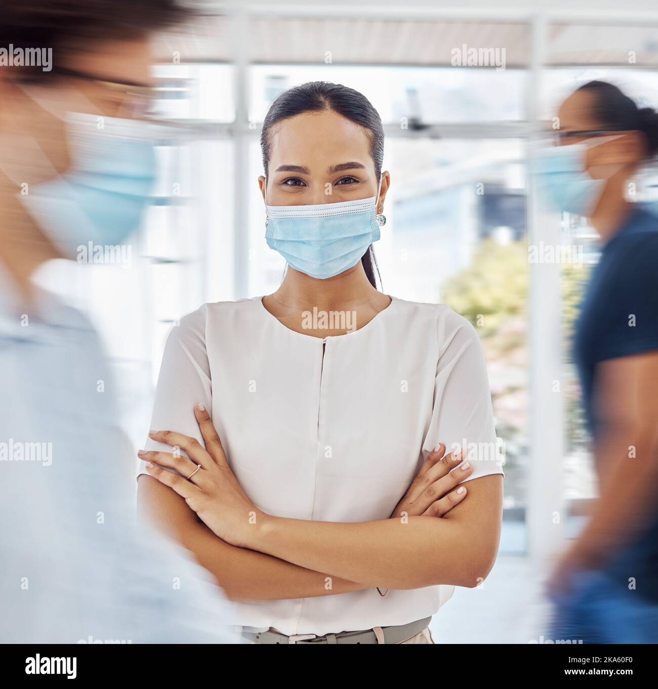 Mask, busy office and business woman portrait happy in modern workplace ...