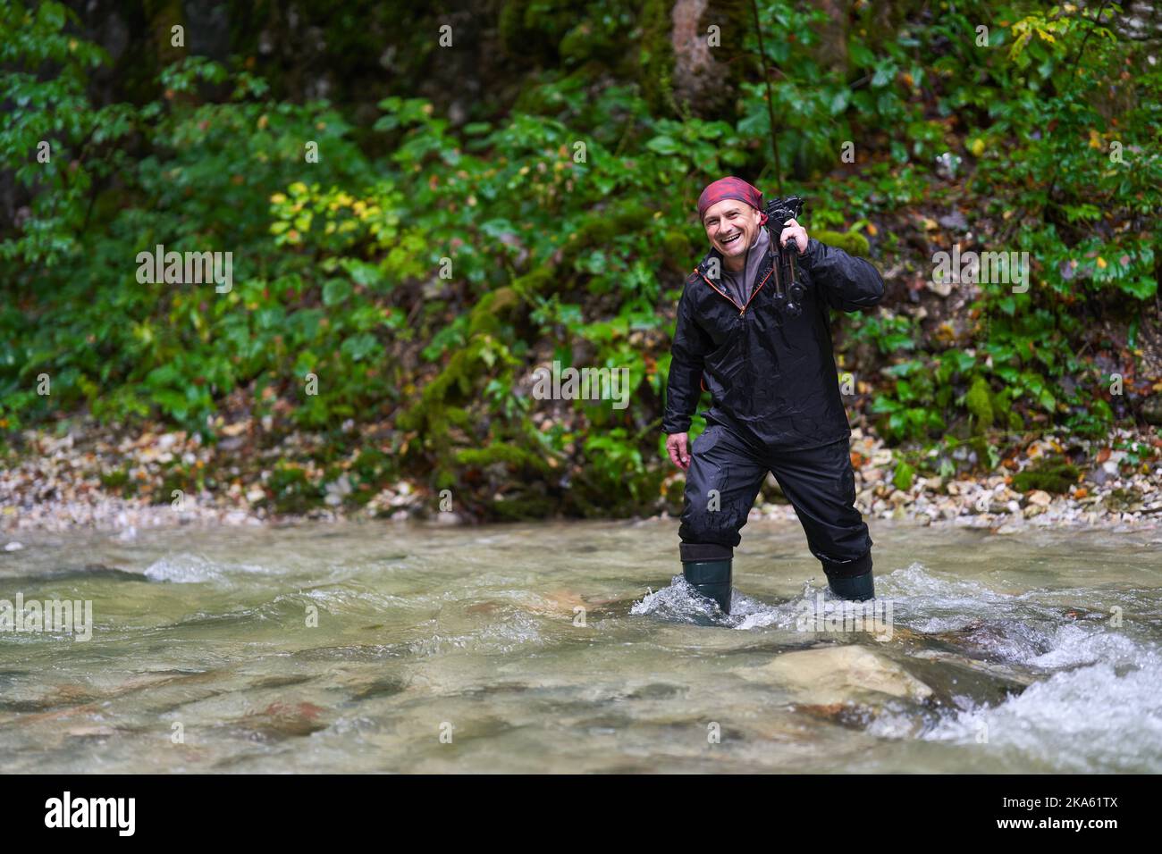 Professional nature photographer shooting landscapes in a canyon with a ...