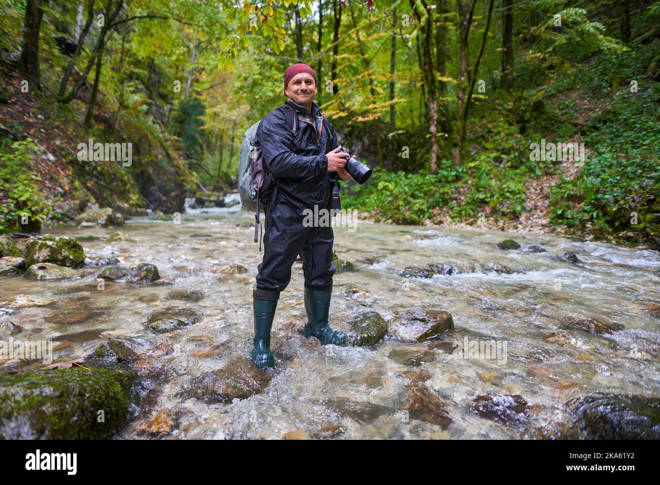 Professional nature photographer shooting landscapes in a canyon with a ...