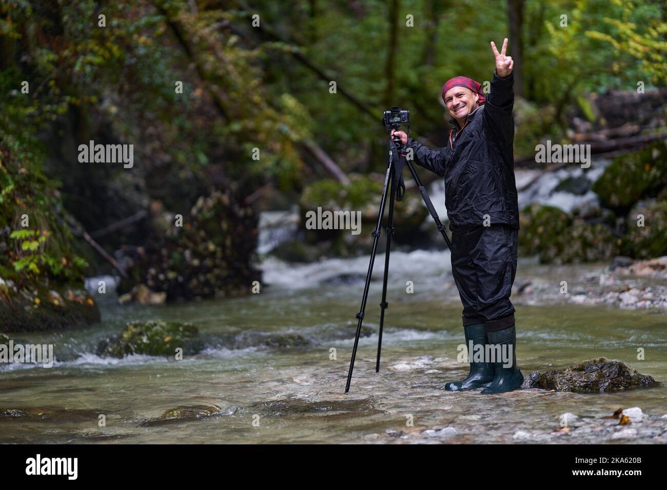 Professional nature photographer shooting landscapes in a canyon with a ...