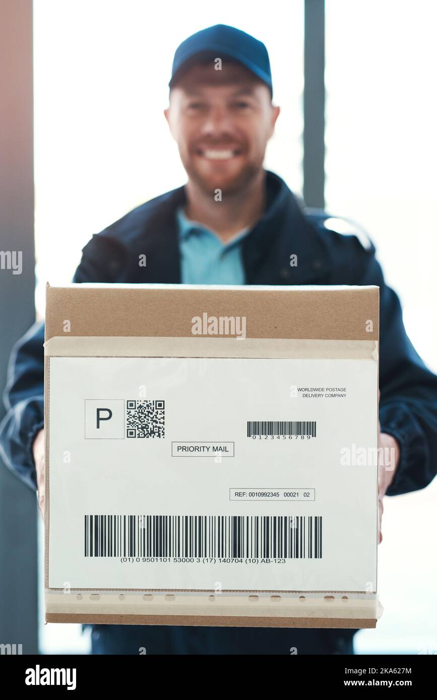 Whos ready to collect their delivery. Portrait of a handsome delivery ...