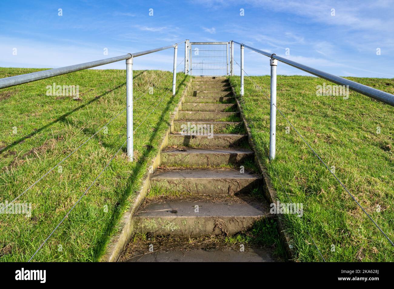 stairs with gate on a dike Stock Photo - Alamy