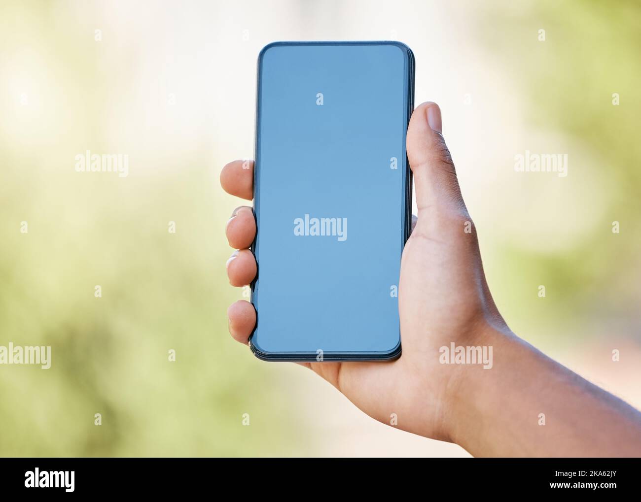 Smartphone, screen mock up and hand in nature for mobile app, social ...