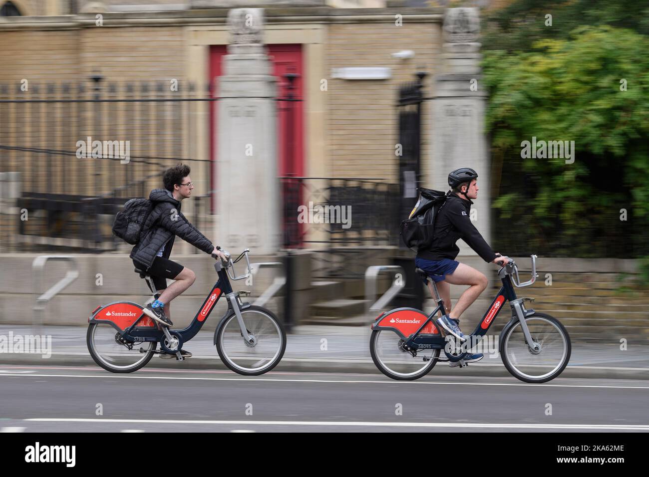 Two male cyclist riding, Transport for London Santander Cycles hire bicycles, commonly know as a ...