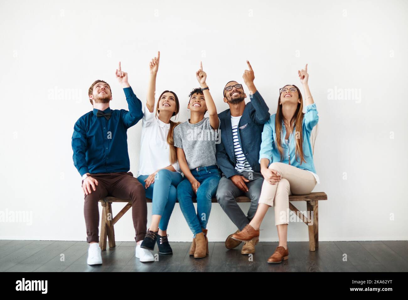 You might want to see this. a group of young people pointing towards ...