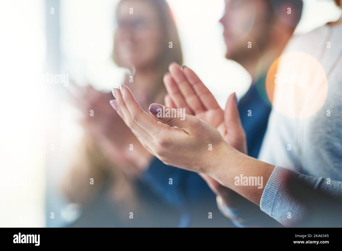 Ill clap to that. a group of businesspeople clapping hands while ...