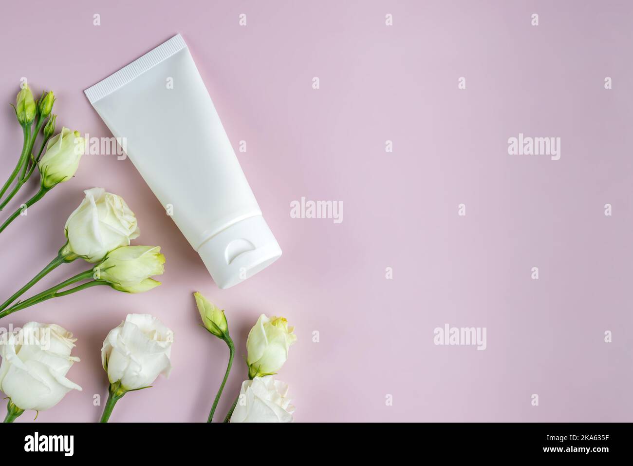 Moisturizer hand cream white plastic tube mockup on pink trandy ...