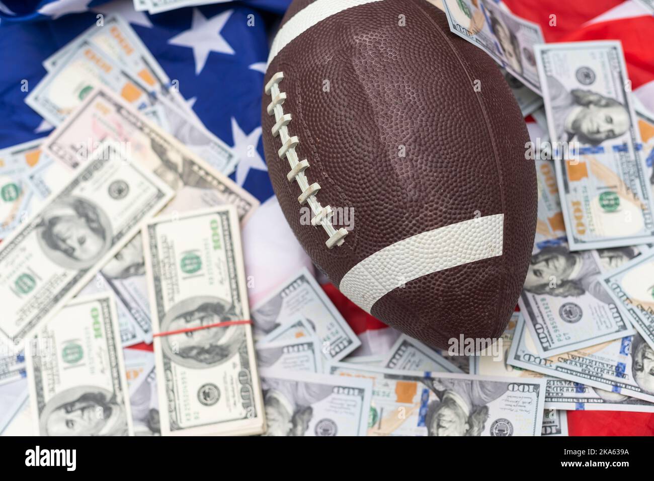 Money and rugby ball on american flag background, closeup. Concept of ...
