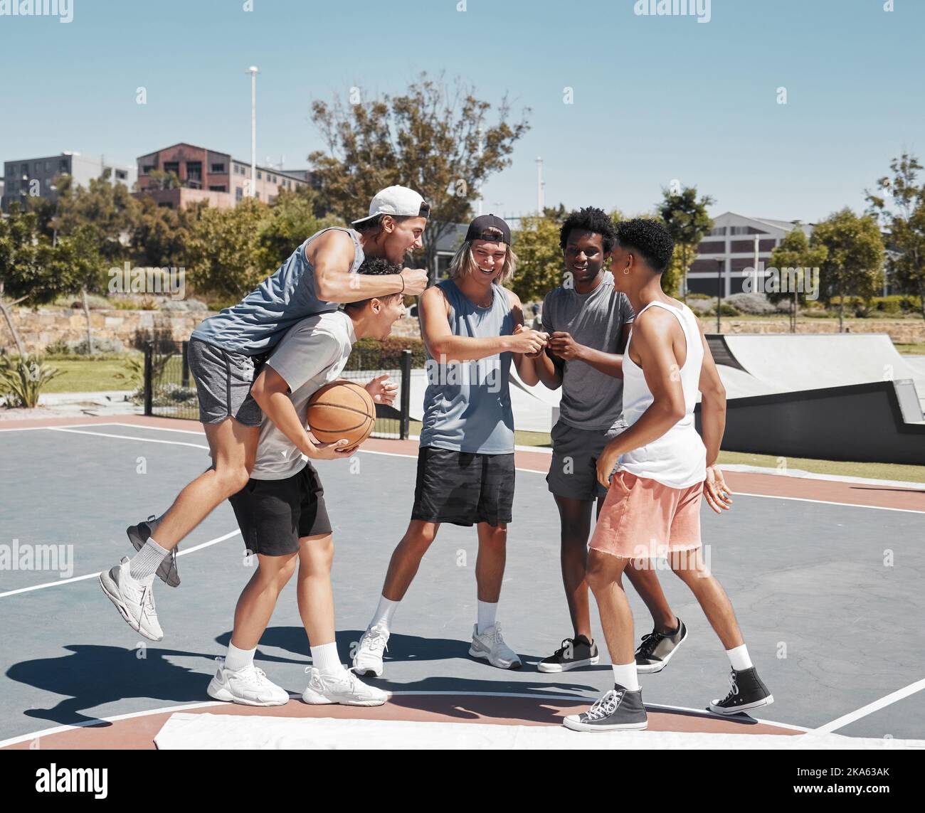 Sports, teamwork and friends with basketball man on court for winner ...