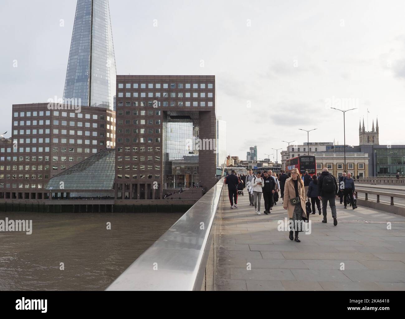 LONDON, UK - CIRCA OCTOBER 2022: People crossing London Bridge over ...