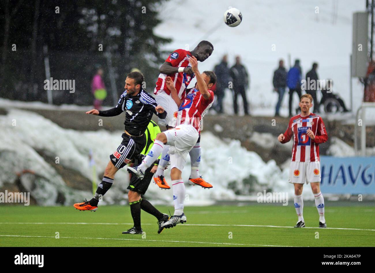 Tromso's Serigne Modou Kara Mbodji and Tore Reginiussen in duel with Odd Grenland's Magnus ...