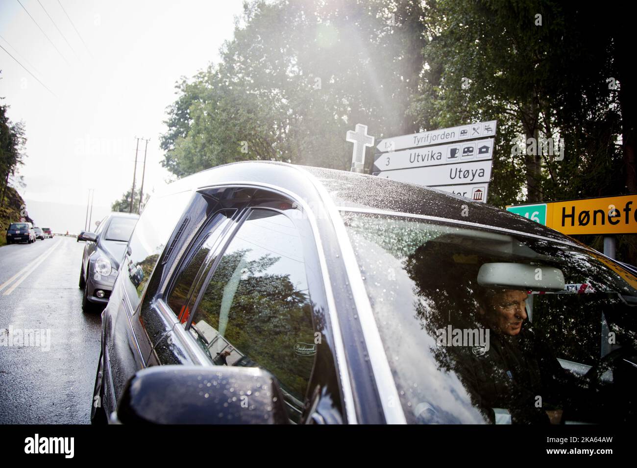 Utøya 20110723. Hearses parked along the road by Tyrifjorden, ready to ...