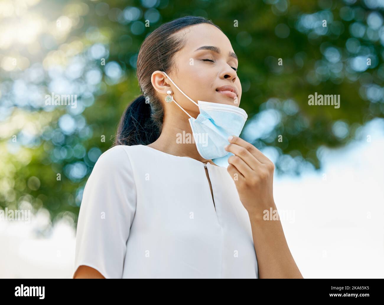 Covid, take off mask and woman breathing, being calm and peaceful ...