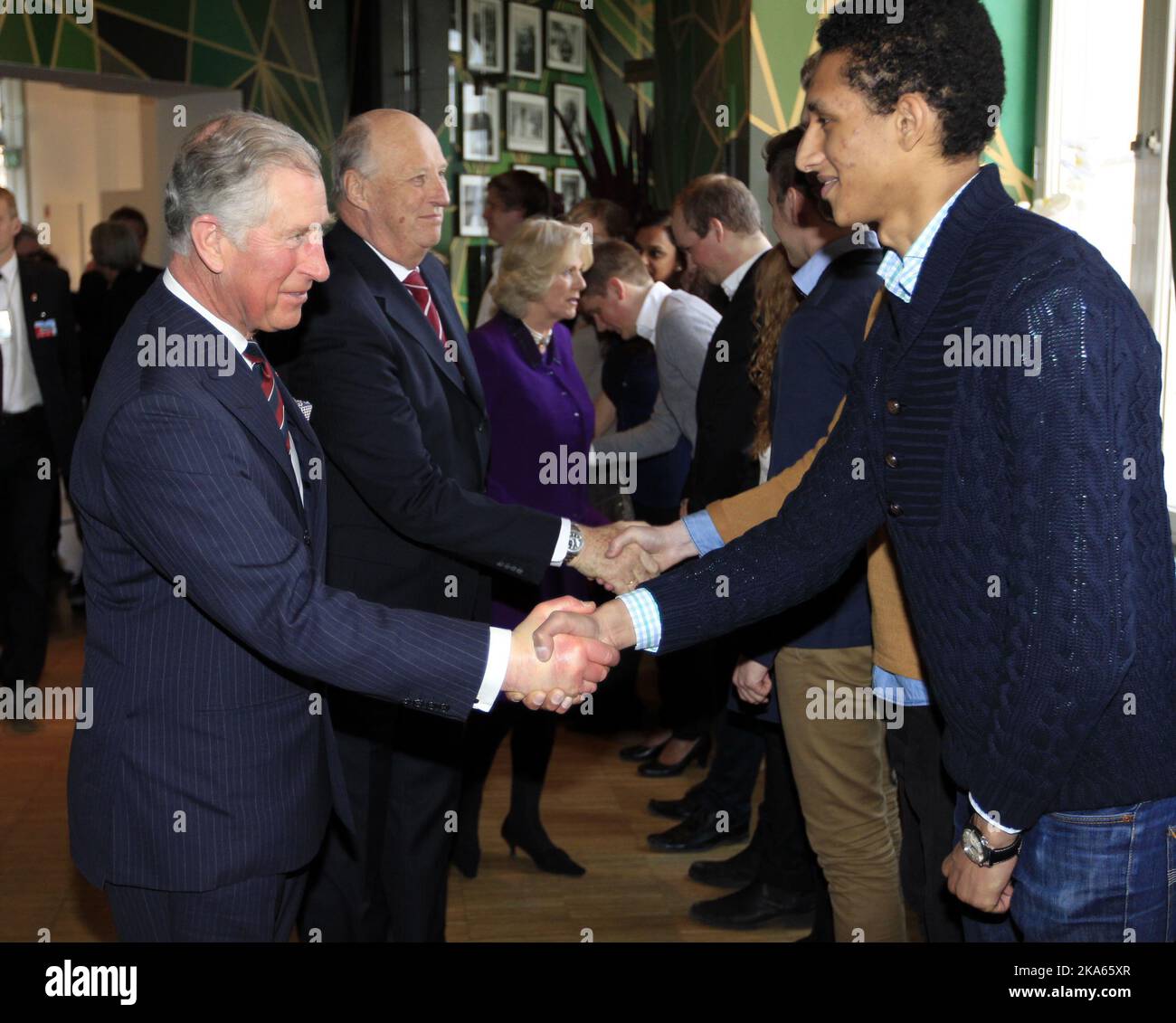 Prince Charles greets Munir Jaber (right) who survived Ut¿ya at Nobel ...