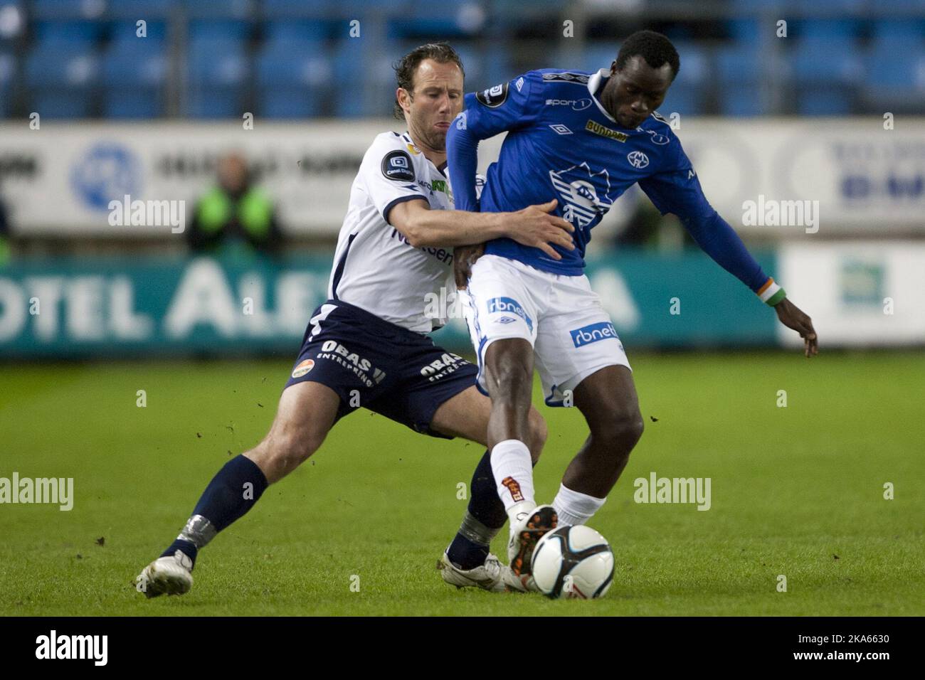 Str¿msgodset IF's Alexander Aas (left) Davy Claude Angan stop (right) during the college ...