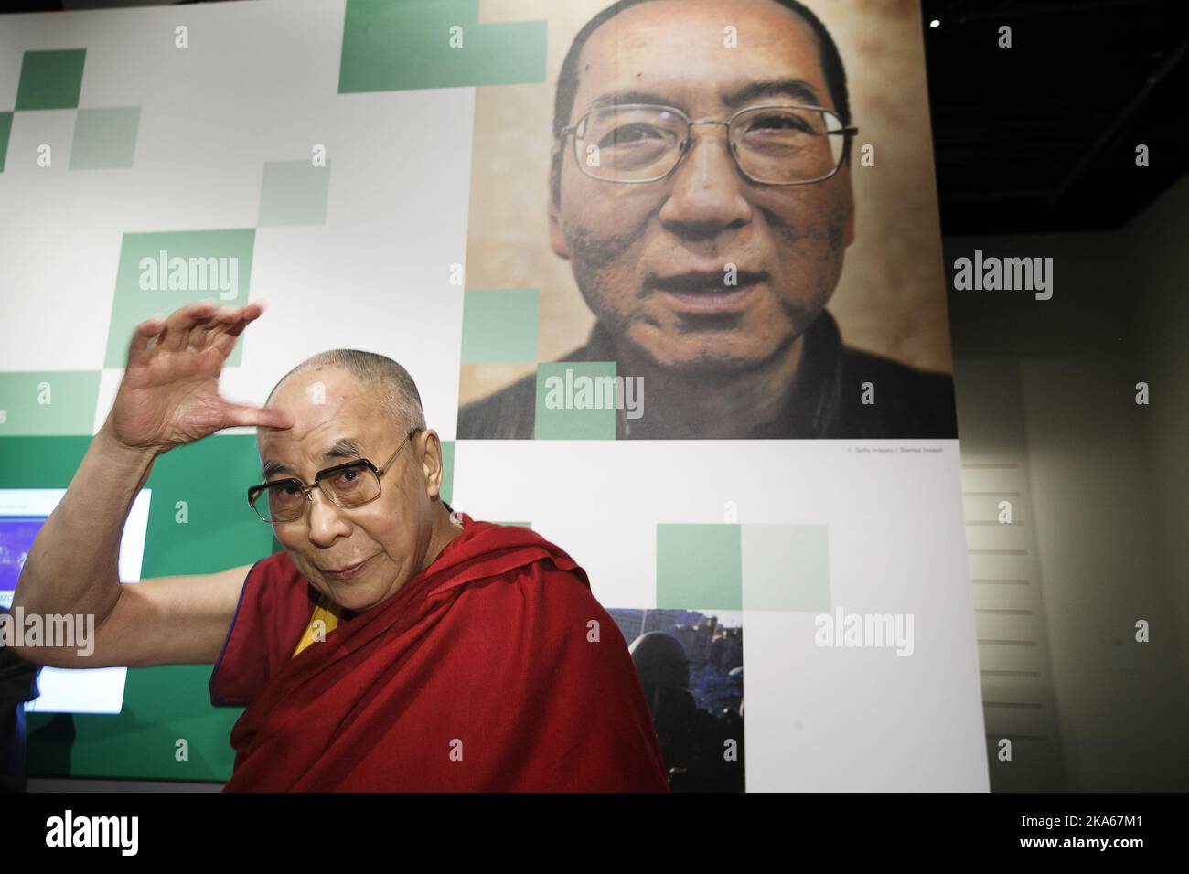 The Dalai Lama visits the Nobel Peace Center where a picture of former ...
