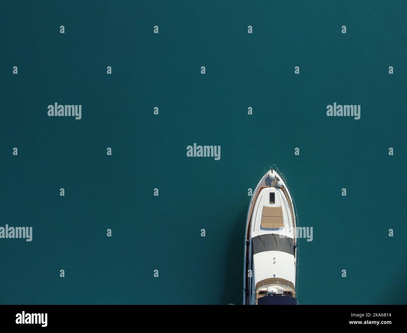 Aerial yacht on calm sea. Luxury cruise trip. View from above of white ...
