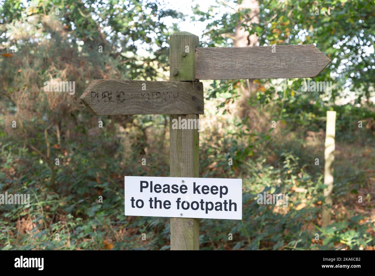 Footpaths signpost with notice please keep to the footpath, Sutton ...
