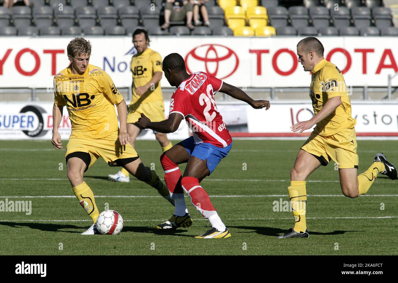 Glimt's Thomas Ronning (left) and Alo Barengrub against Lyn's Odion ...