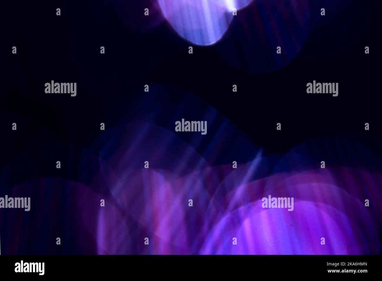 Blur purple rainbow crystal light leaks on black background. Defocused ...