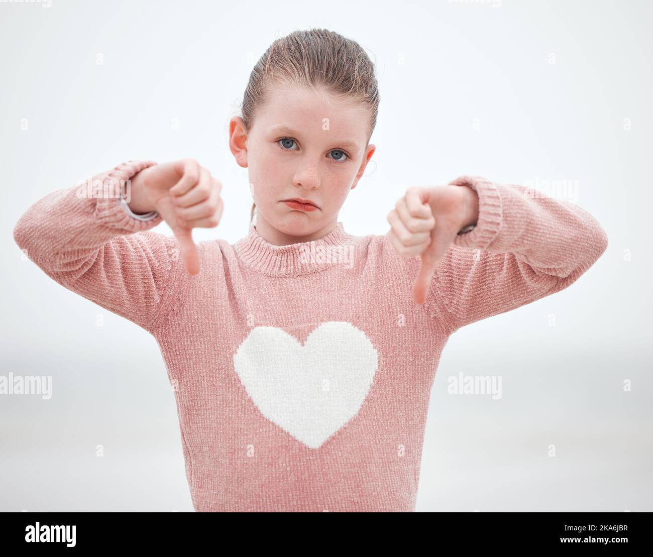 Thumbs down, sad kid and girl portrait show wrong sign, poor review and ...