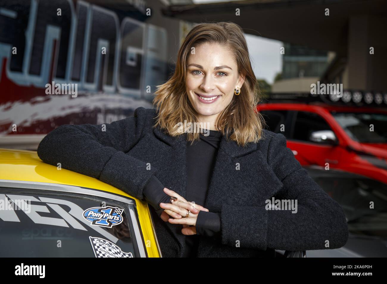 OSLO, Norway 20161012. Actor Jenny Skavlan posing in front of the cars ...