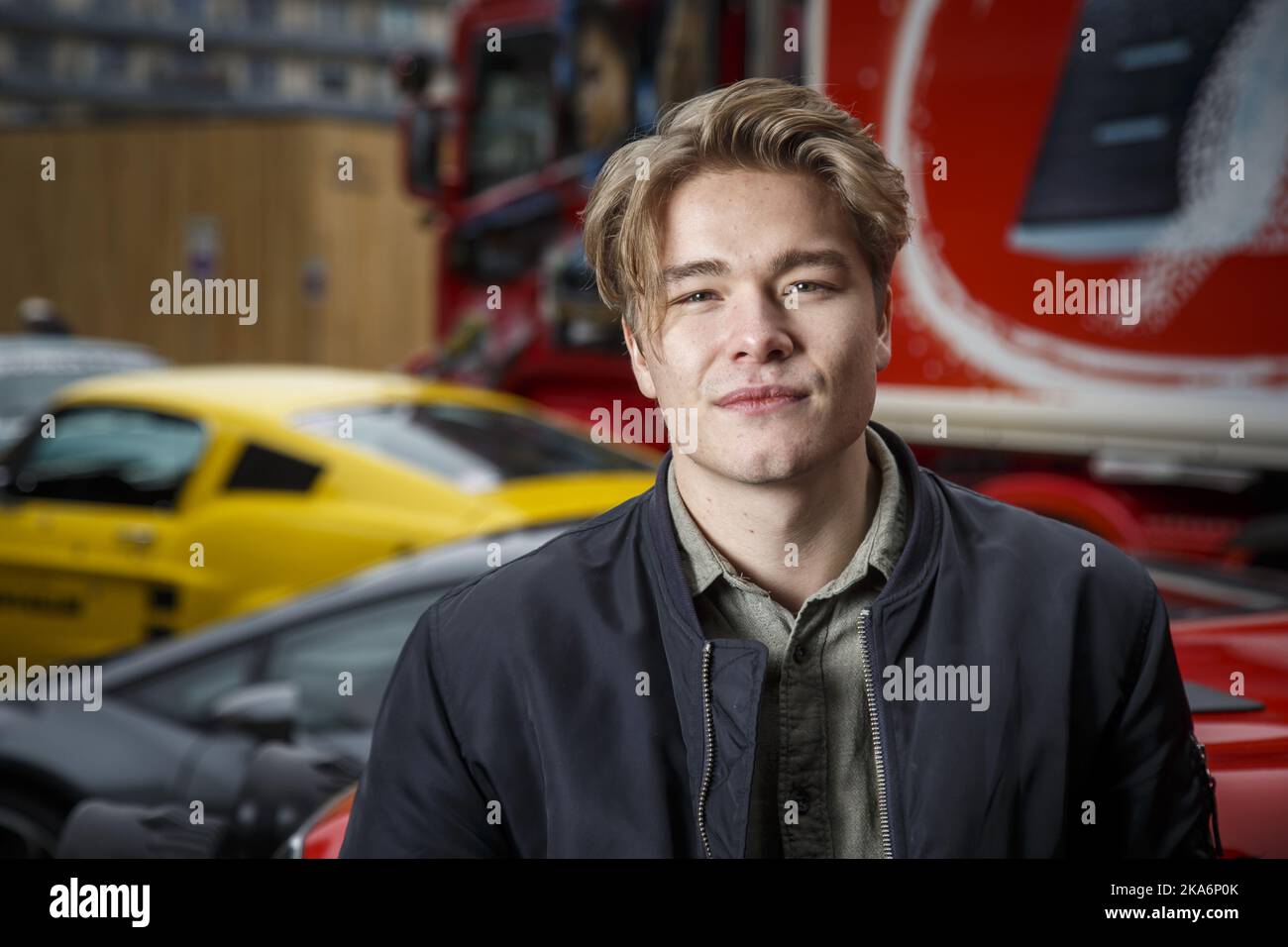 OSLO, Norway 20161012. Actor Jonas Oftebro posing in front of the cars ...