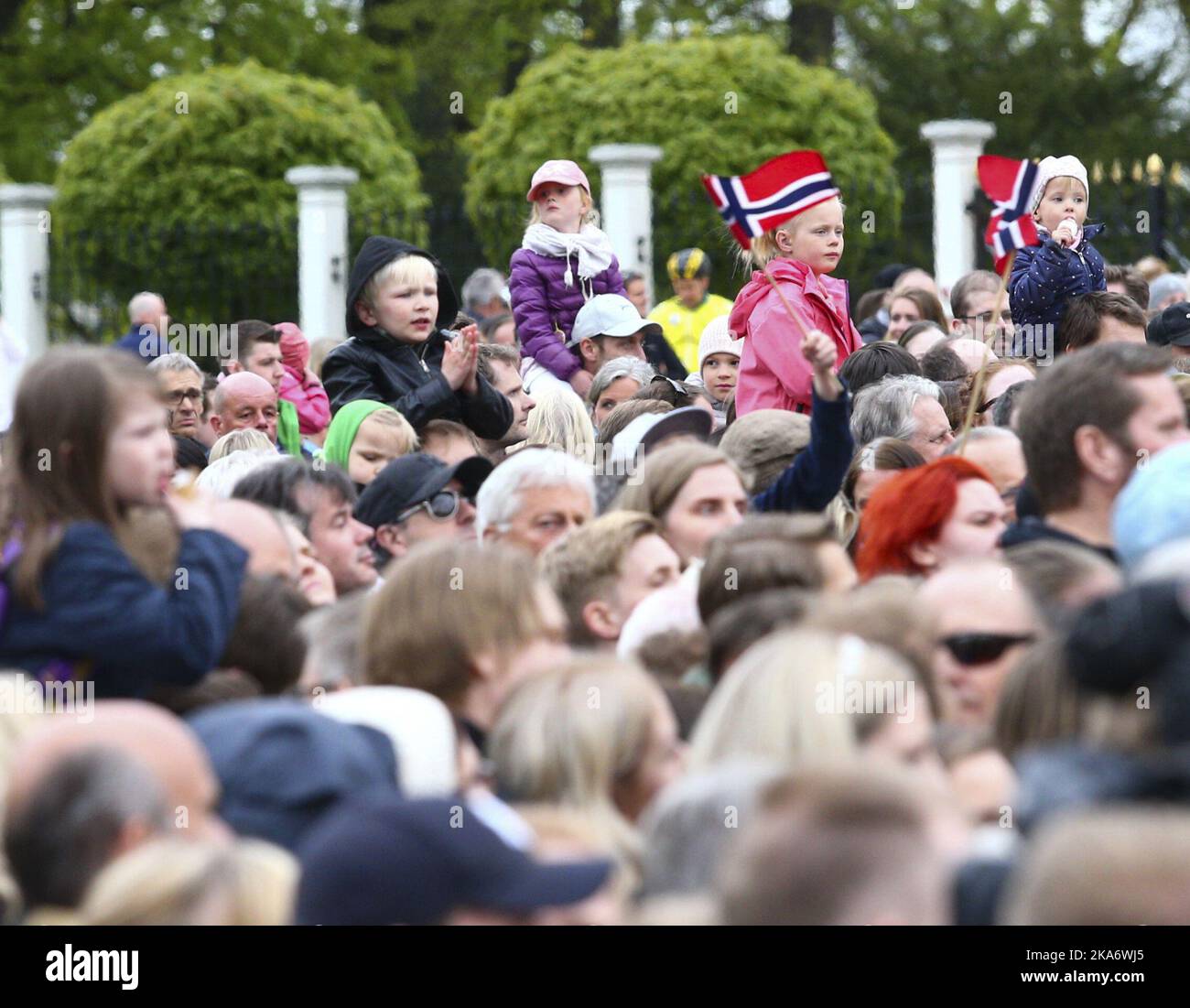 Oslo, Norway 20170509. Children eat ice cream and holds Norwegian flags ...