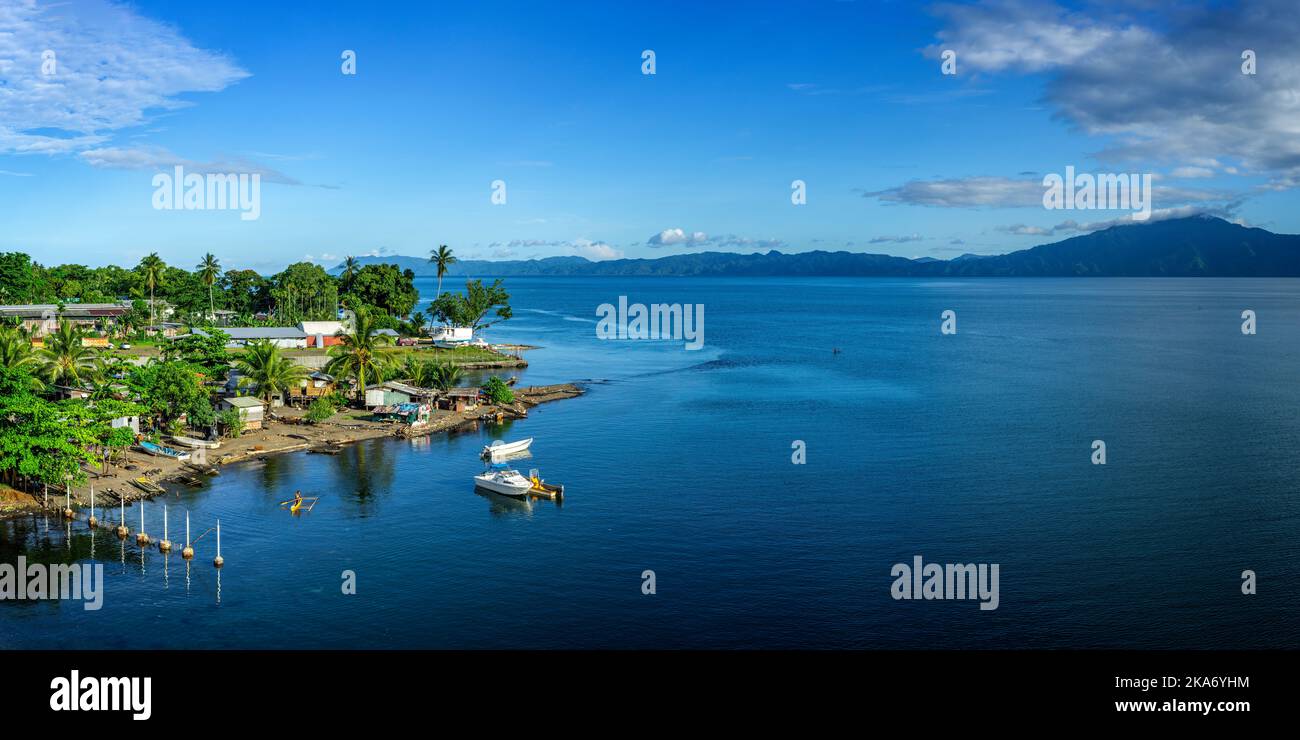 Fishing village set on foreshore of Milne Bay, Alotau, Papua New Guinea ...