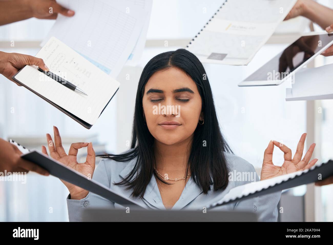 Busy, stress and woman meditate in the office, hands holding paperwork ...