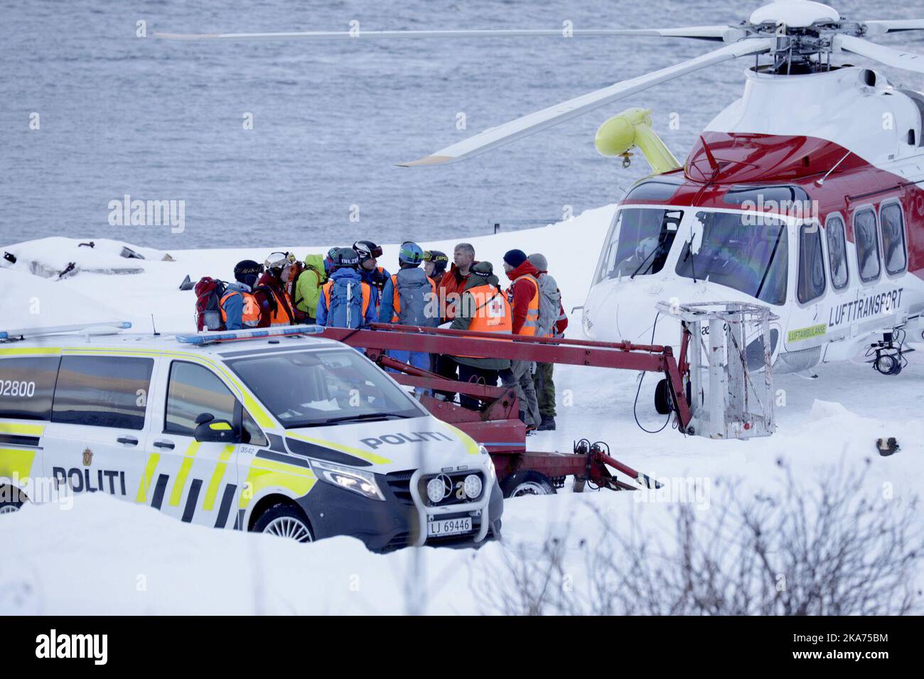 Ambulance helicopters and crew gathered near the place where a person ...
