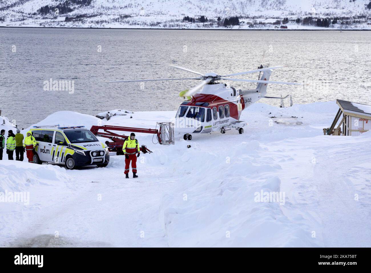 Ambulance helicopters and crew gathered near the place where a person ...