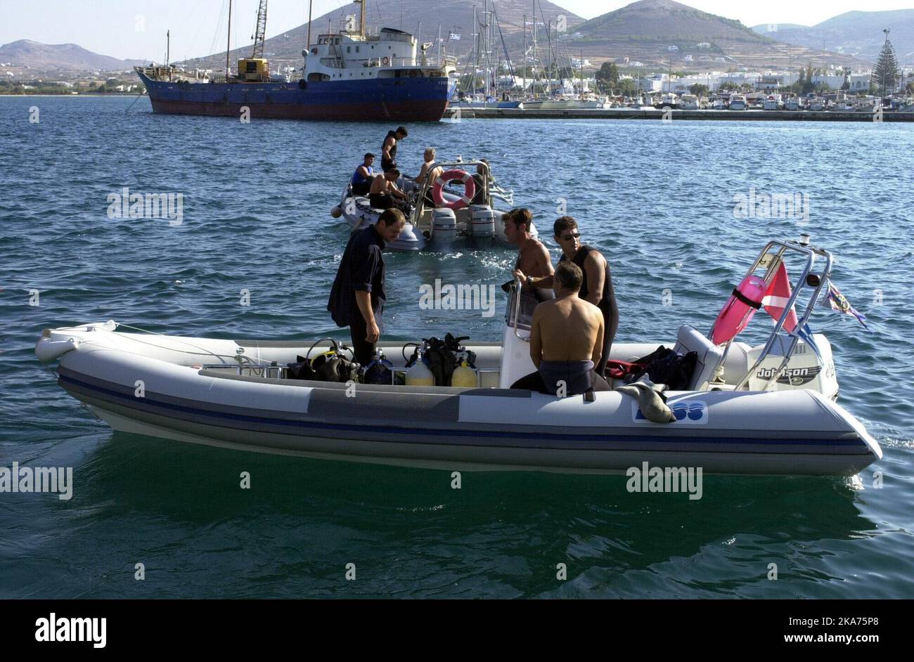 Divers on their way in after searching in the sea after perishing after ...